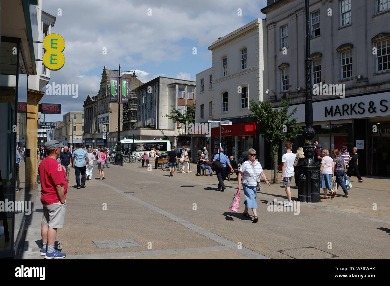 Shoppers and shops. Cheltenham High Street Stock Photo - Alamy