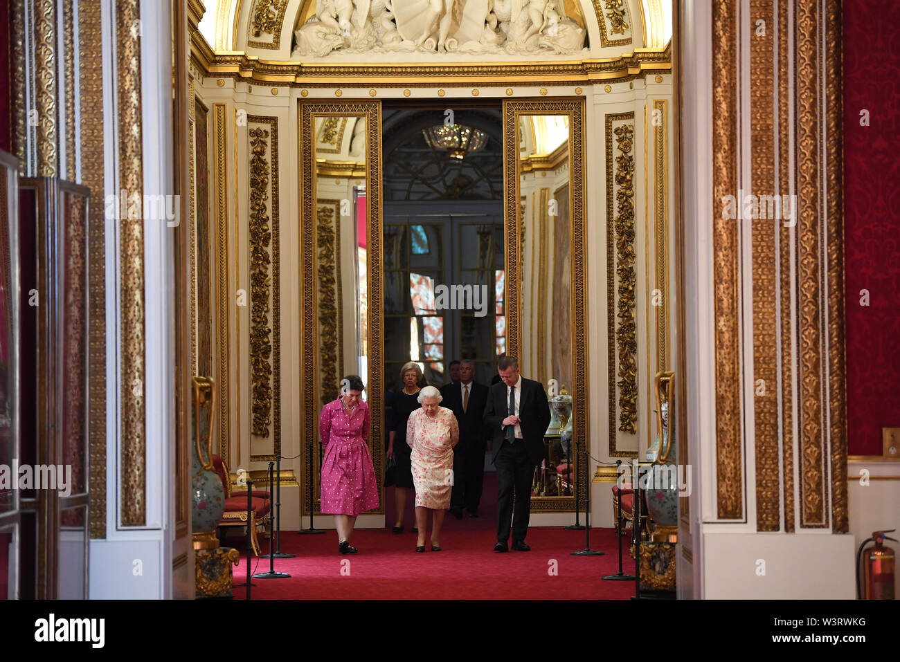 Queen Elizabeth II (centre) during a private viewing of the exhibition ...