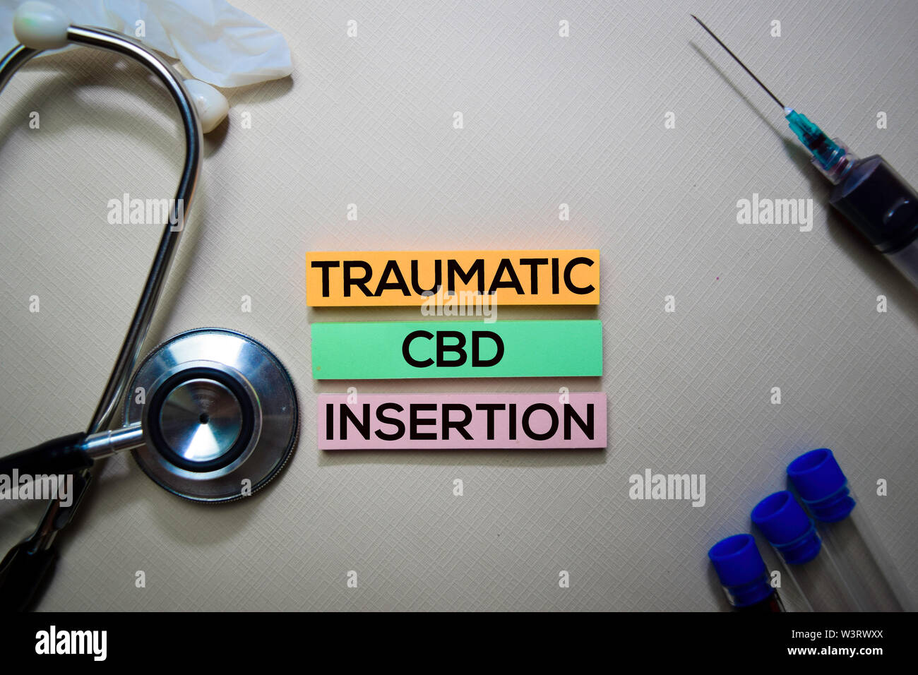 Traumatic CBD Insertion text on Sticky Notes. Top view isolated on ...
