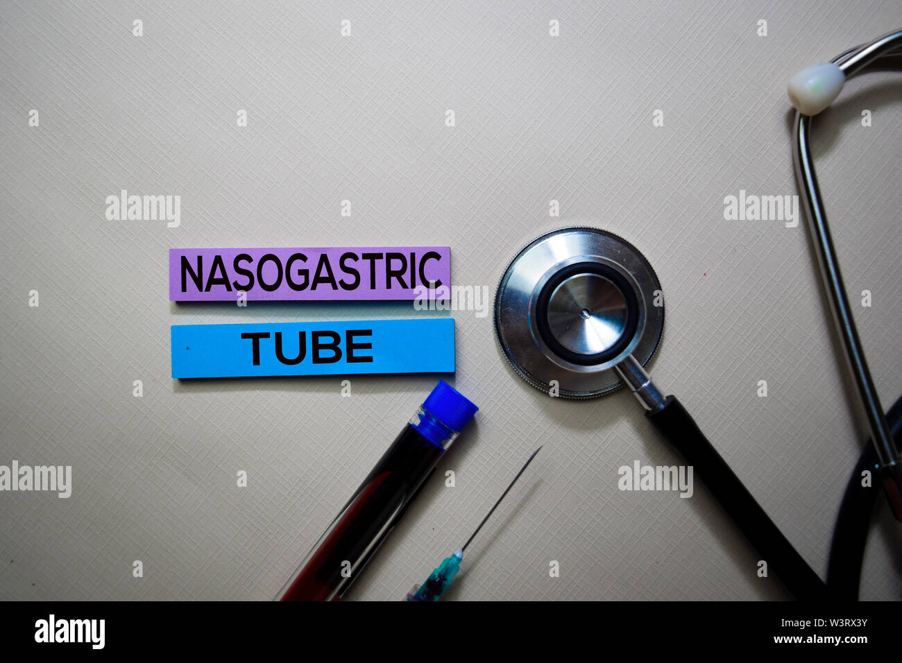 Nasogastric Tube text on Sticky Notes. Top view isolated on office desk ...