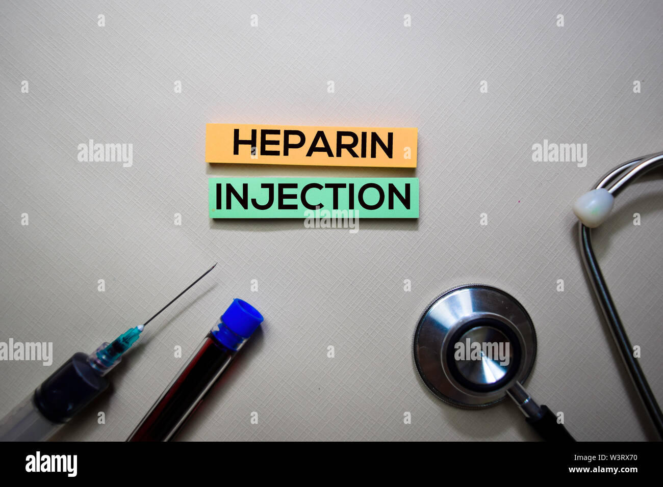 Heparin Injection text on Sticky Notes. Top view isolated on office ...