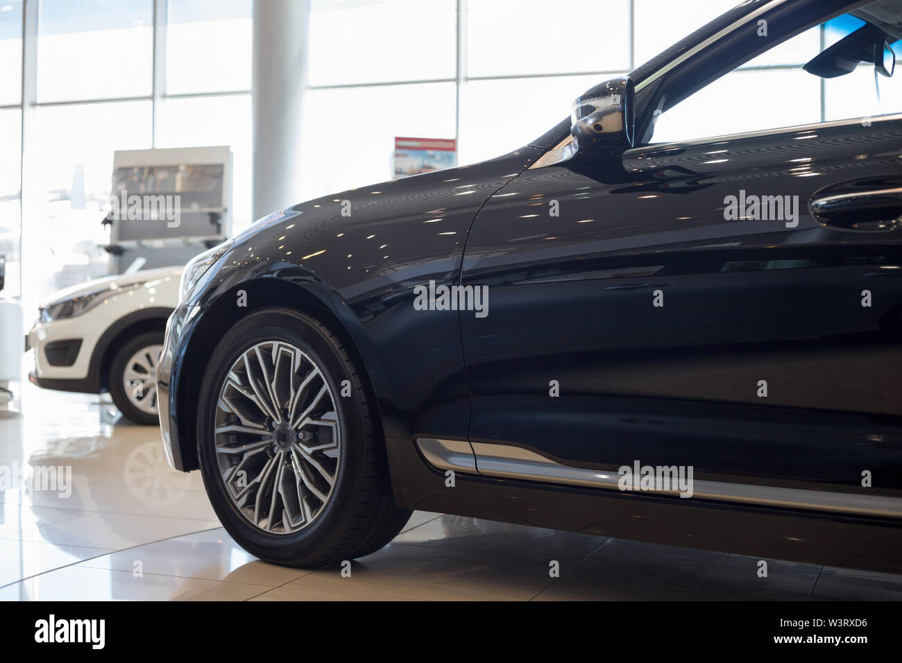 New cars in the dealer showroom. Prestigious vehicles. Modern ...