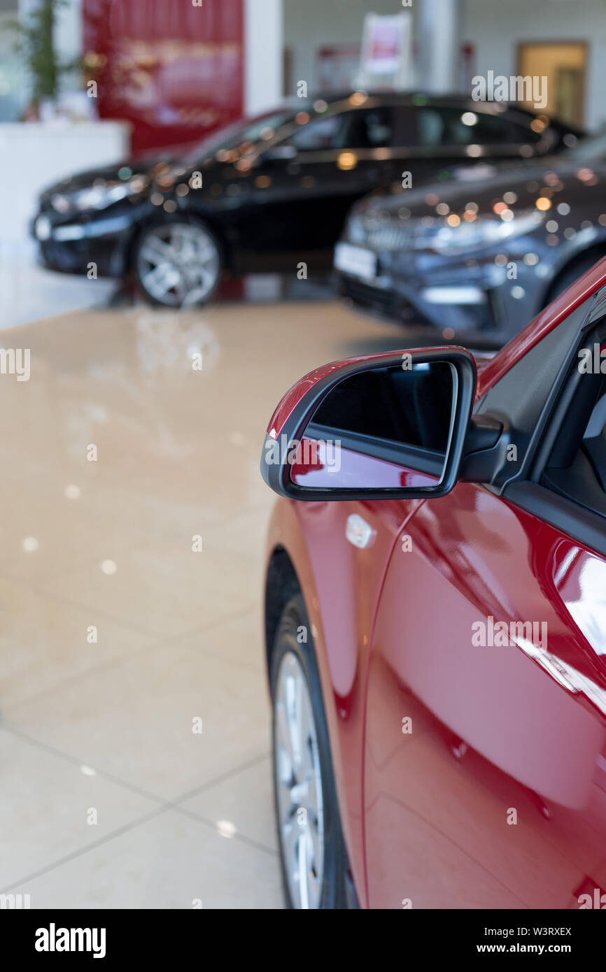 Car auto dealership. New cars at dealer showroom. Prestigious vehicles ...