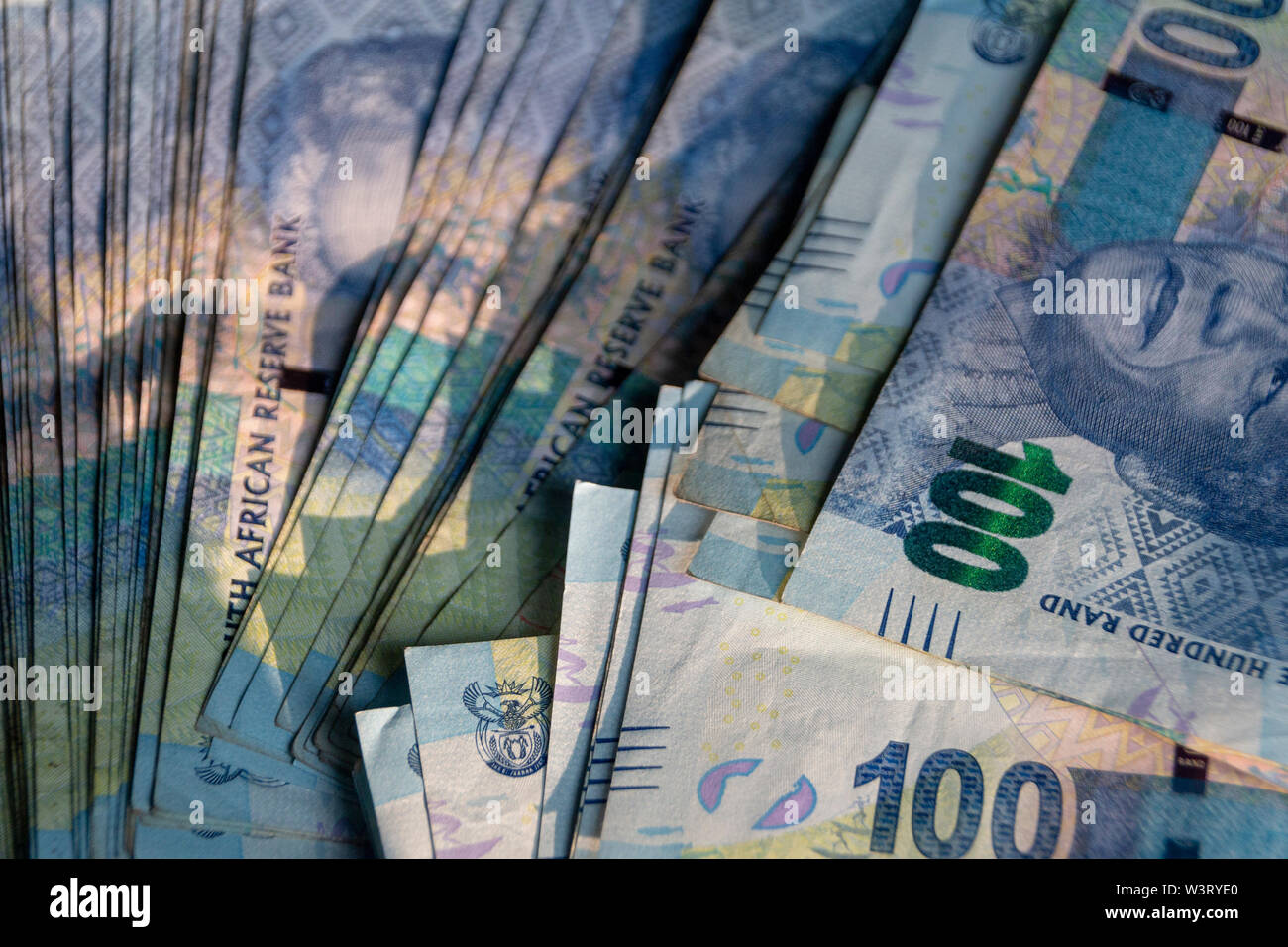 A close up view of fifty rand south african notes in a pile on a ...