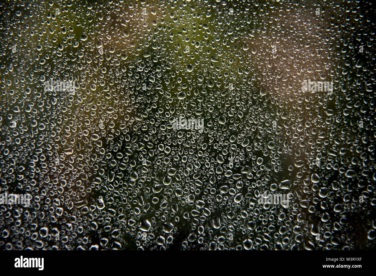 Raindrops on the glass as a fancy backdrop. Copy space Stock Photo - Alamy