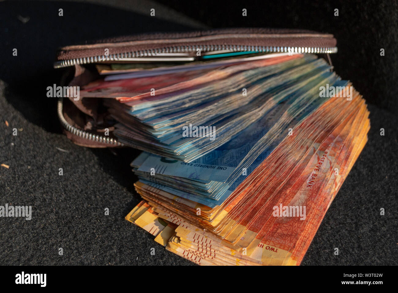 A close up view of pile of two hundred, one hundred and fifty rand ...