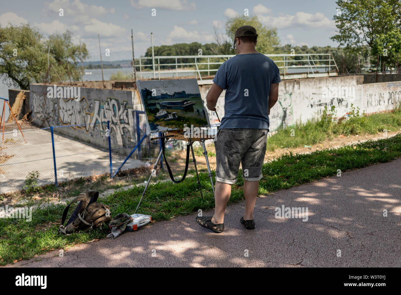 Belgrade, Serbia, July 15th 2019: Male artist painting landscape at the ...