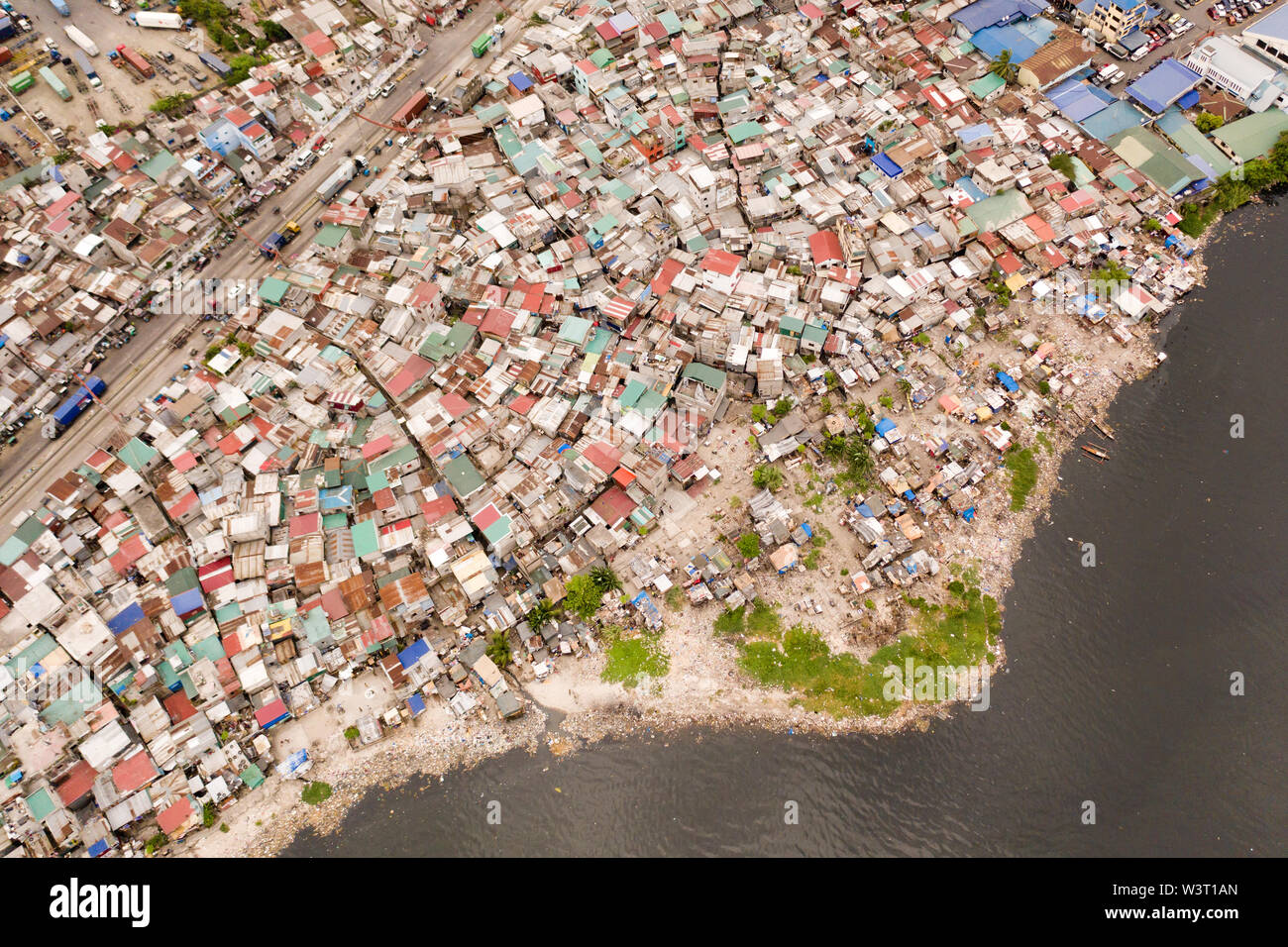 Slums in Manila, a top view. Sea pollution by household waste. Plastic ...