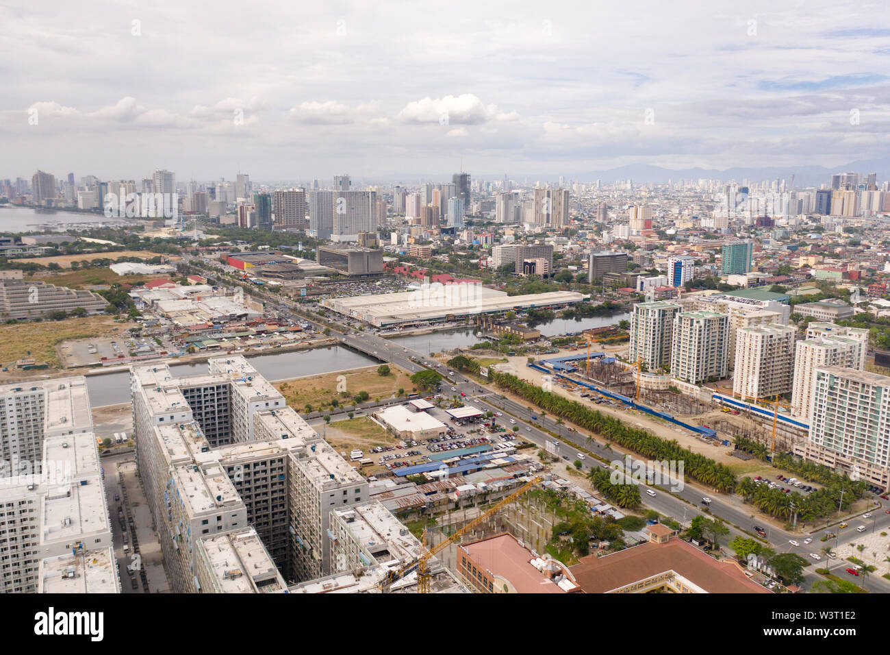 Construction of high modern houses in Manila. The city of Manila, the ...