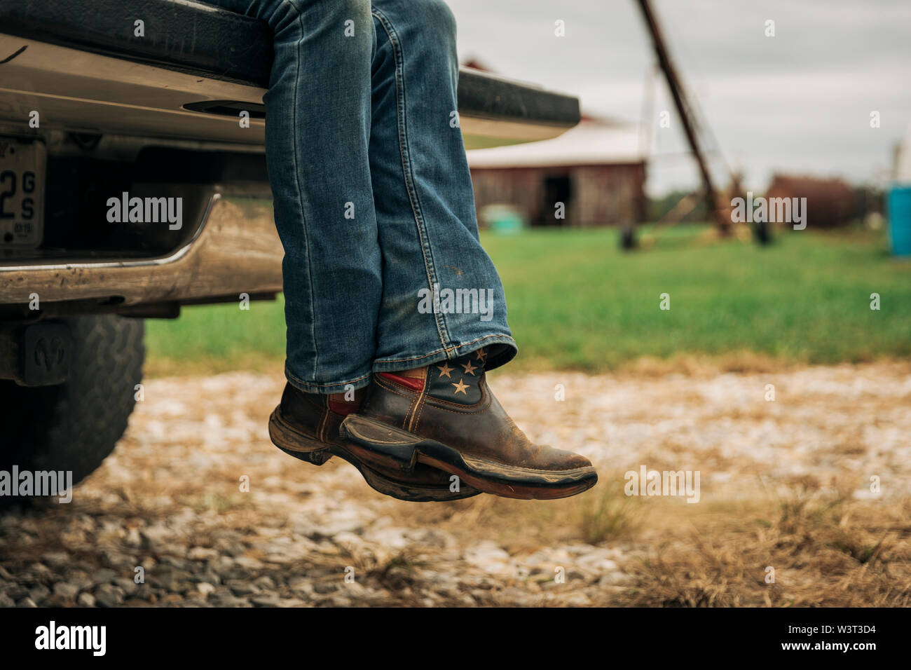 American Flag Cowboy Boots on Pickup Truck Tailgate Stock Photo - Alamy