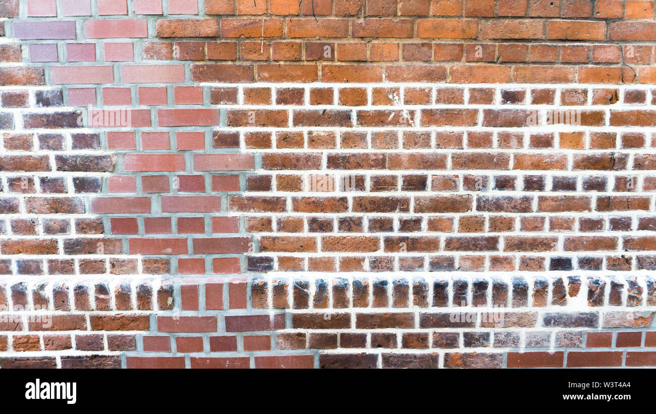 repaired red brick wall Stock Photo - Alamy