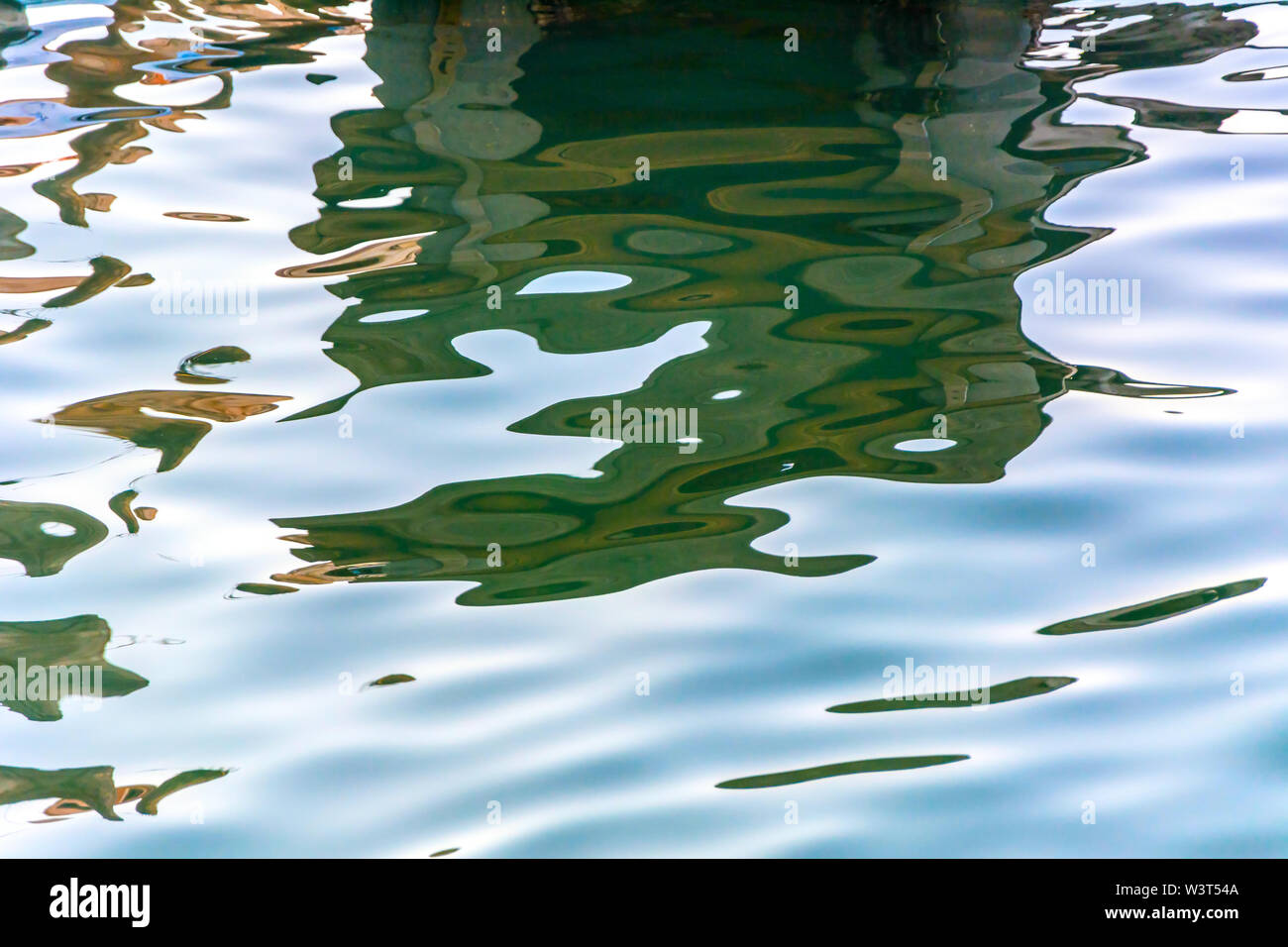 water texture background close up. Bright colorful water reflection ...