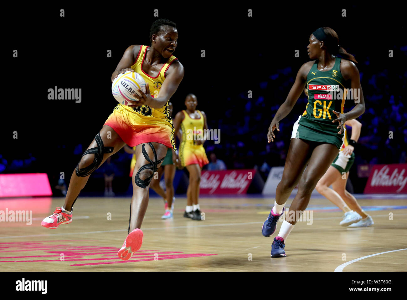 Uganda's Peace Proscovia (left) in action during the netball World Cup ...