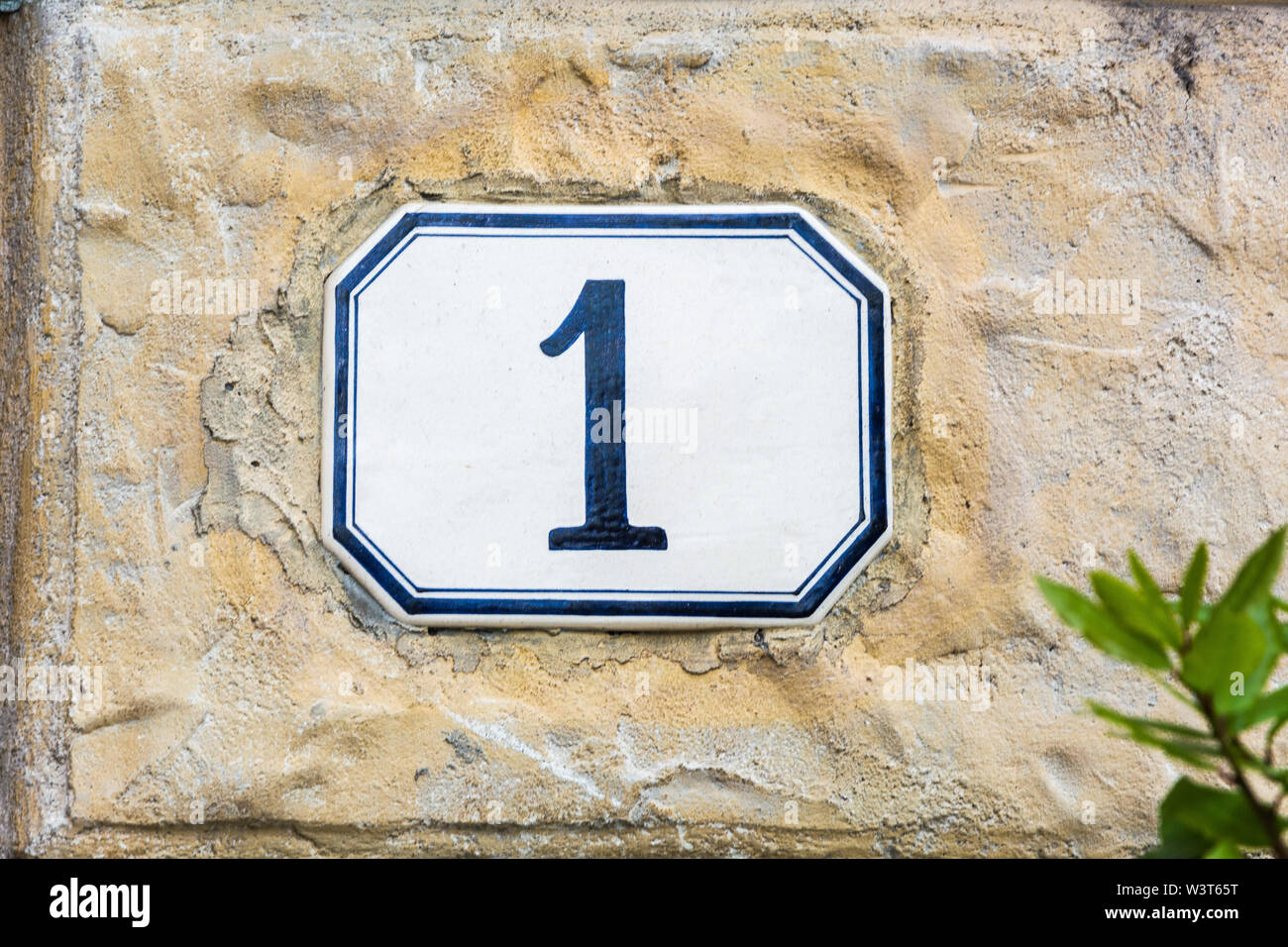 house number one ( 1 ) on a roughcast wall Stock Photo - Alamy