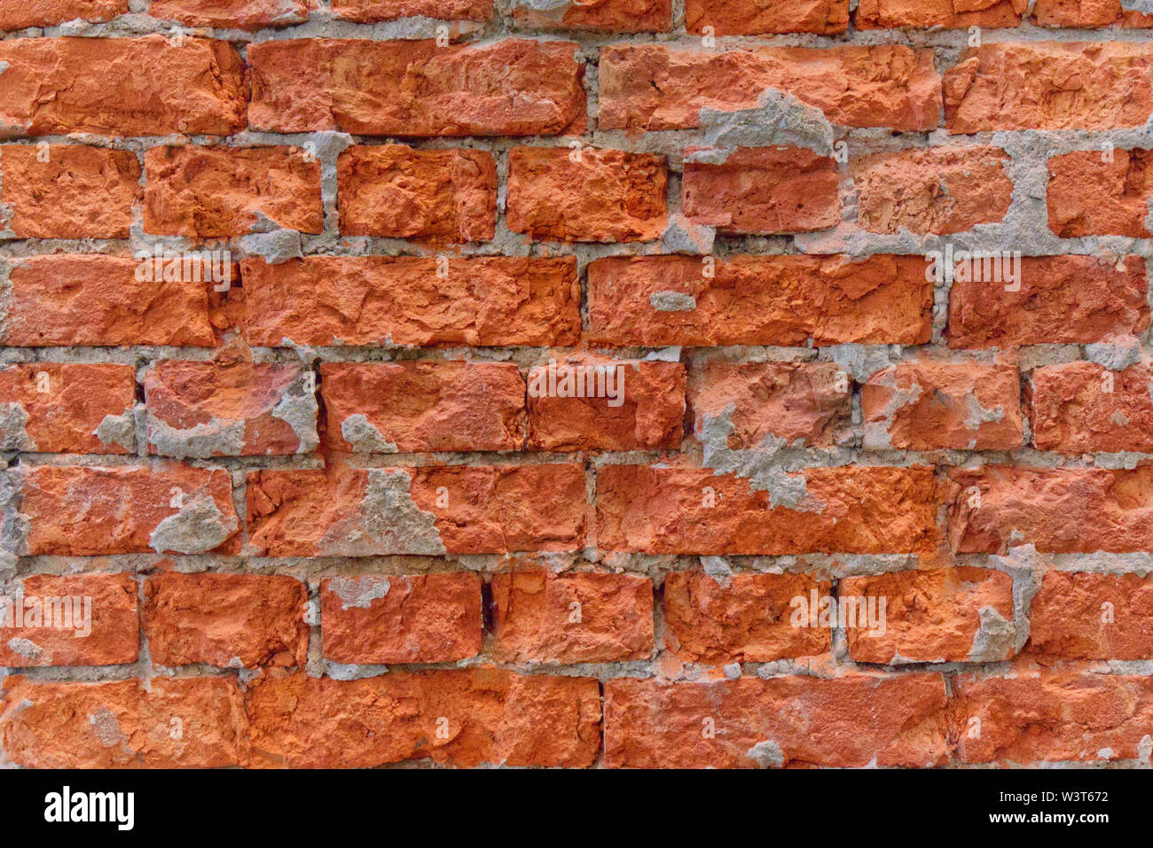 Abstract image texture for designers with red broken blocks wall. May ...