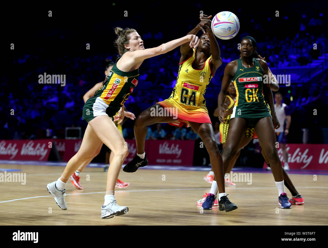 Uganda's Stella Oyella (centre) and South Africa's Karla Pretorius in ...