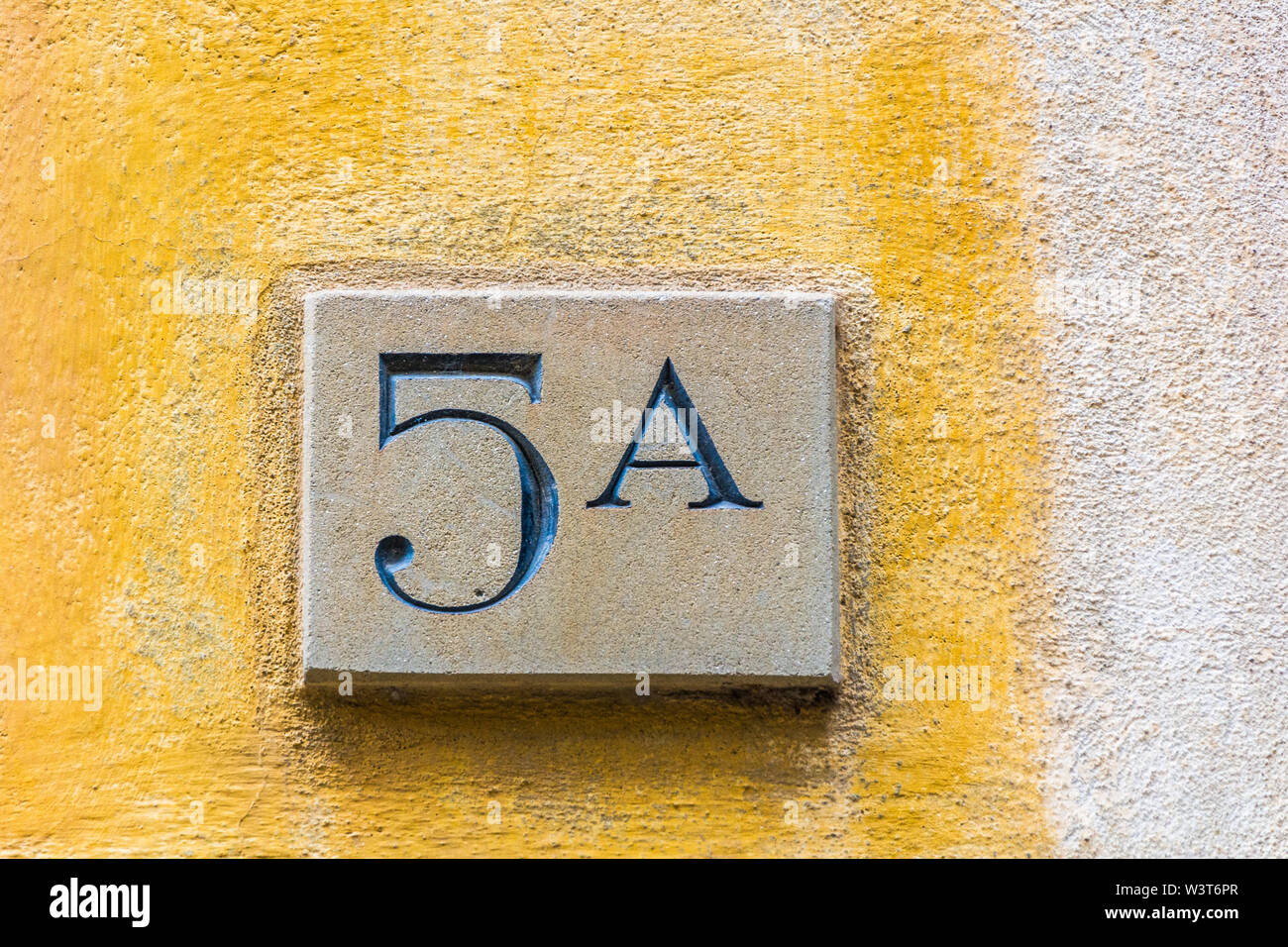 house number five ( 5 ) on a roughcast wall Stock Photo - Alamy