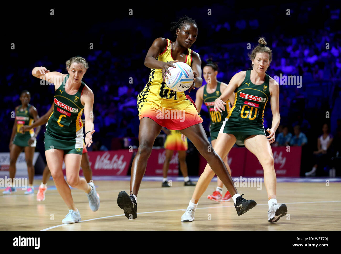 Uganda's Stella Oyella (centre) in action during the netball World Cup ...