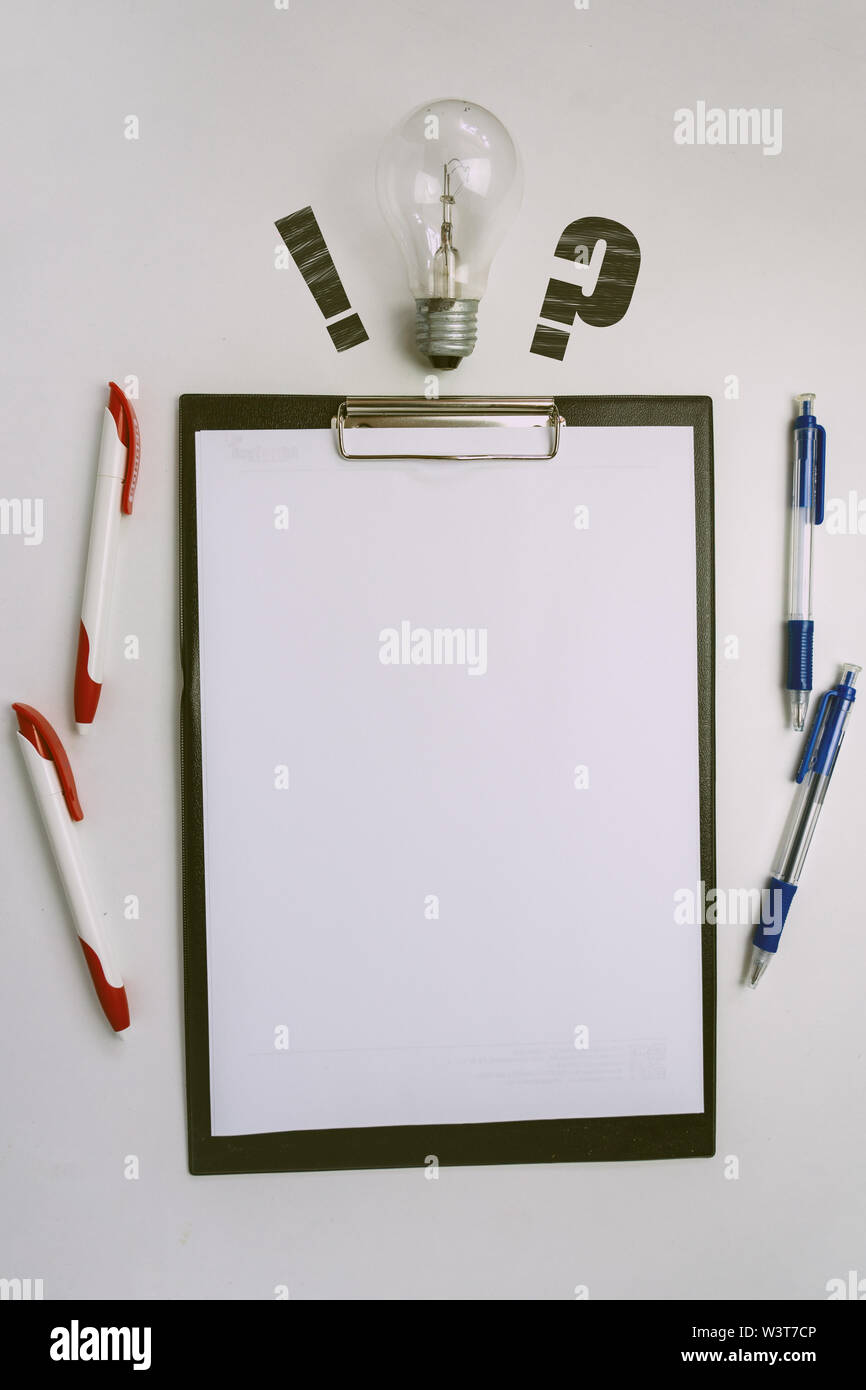 Blank paper with an light bulb and pencil waiting for idea concept ...