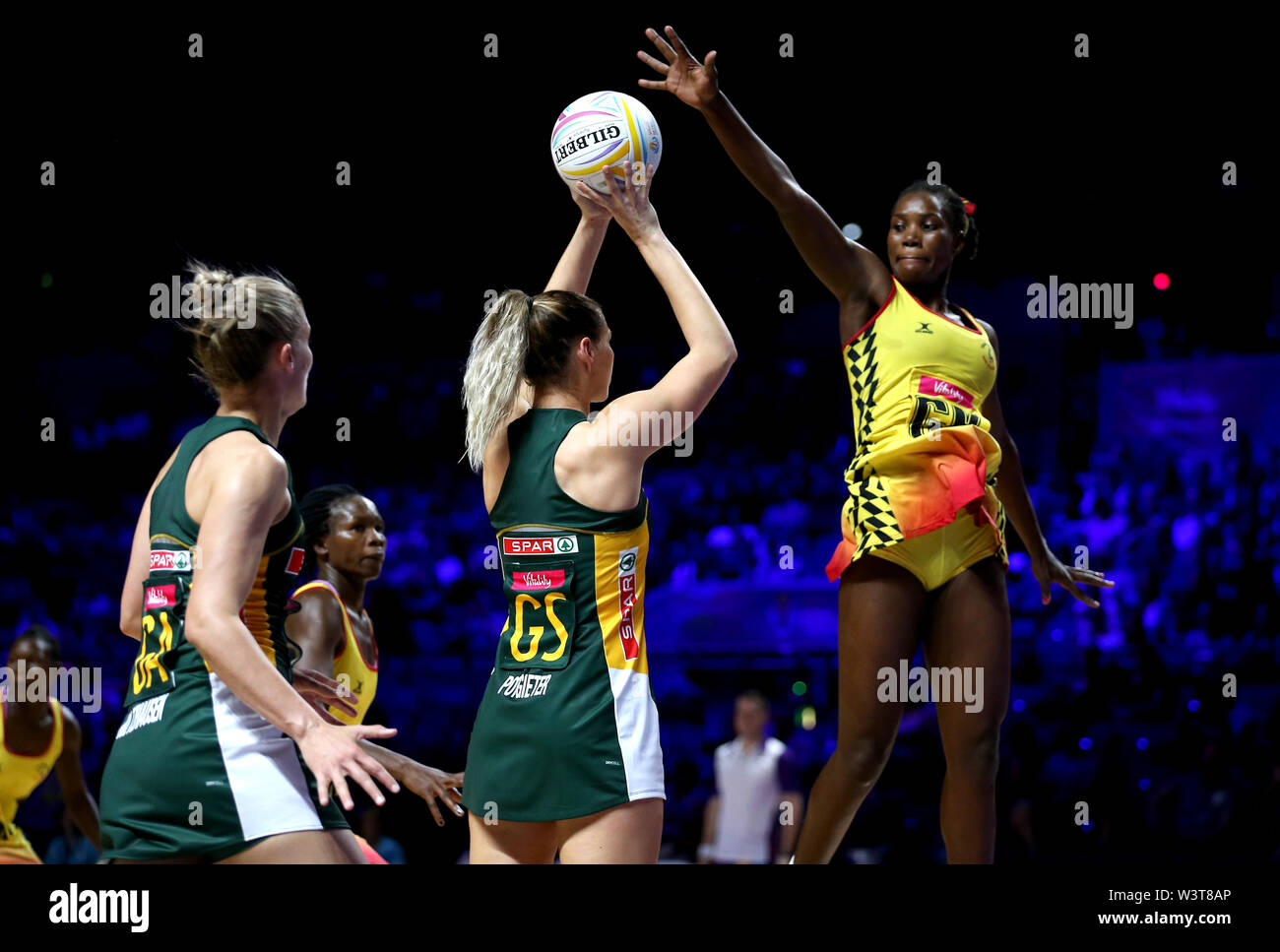 South Africa's Lenize Potgieter (centre) and Uganda's Stella Nanfuka in ...