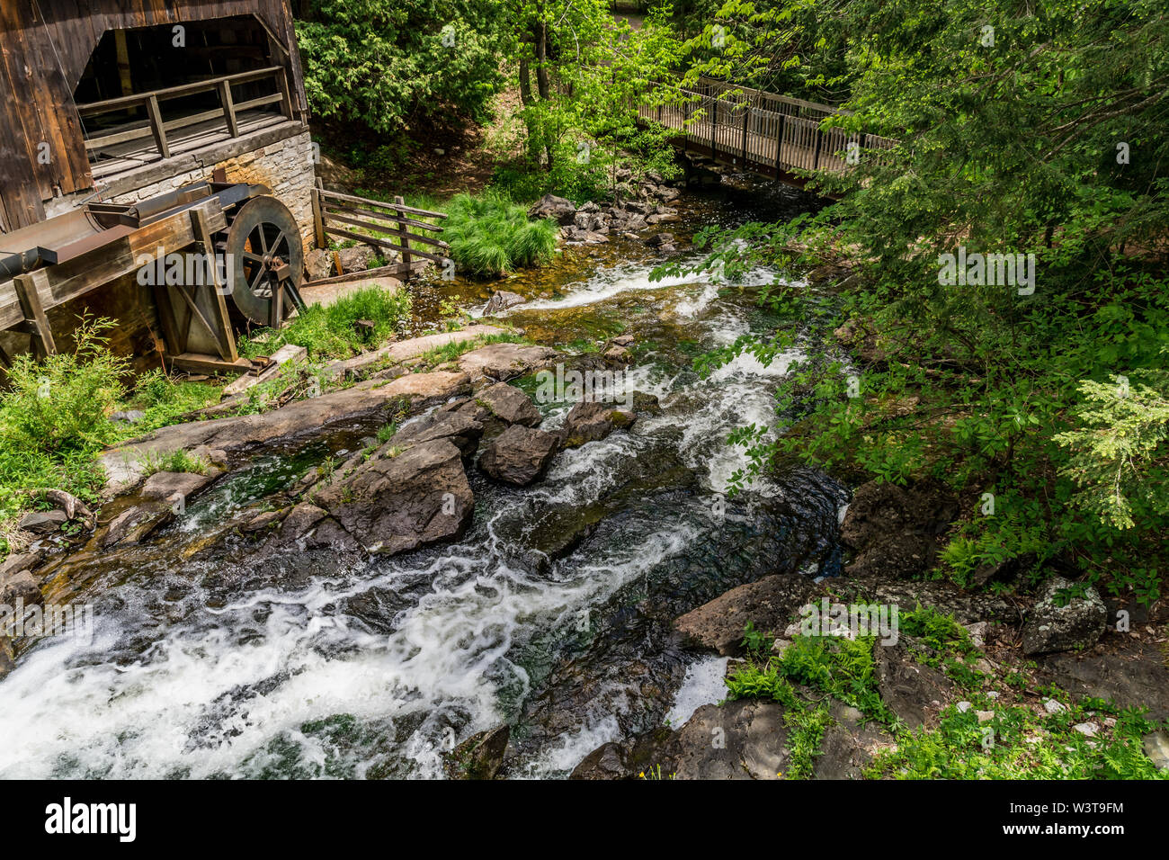 Old mill building showing water and mill wheel Stock Photo - Alamy