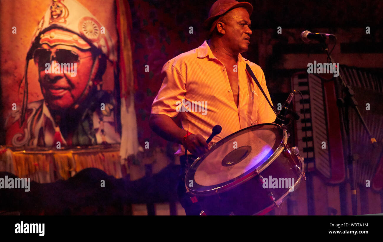 Musician playing a zabumba in a Forro music festival (Festival de ...