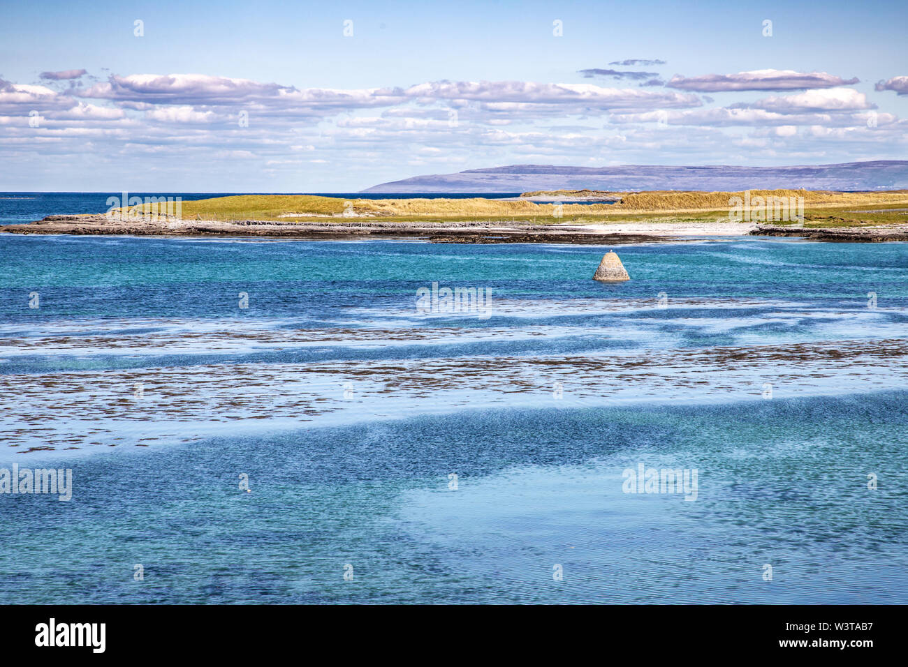 Beach around Inishmore Island with Burren mountains in background, Aran ...
