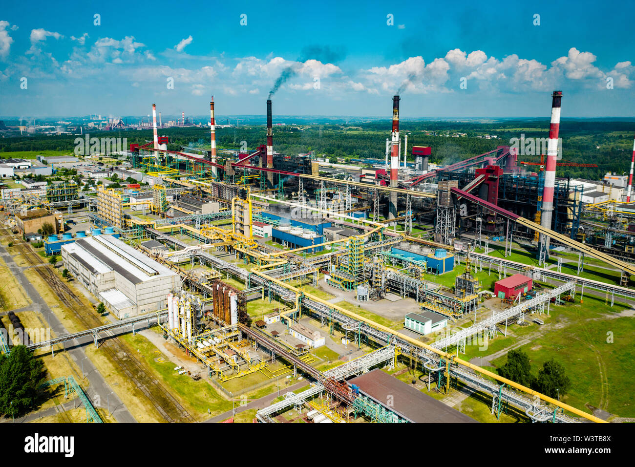 Industrial landscape with heavy pollution produced by a large factory ...