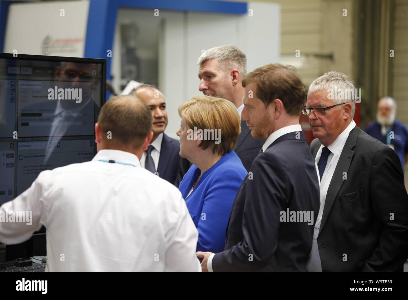 Michael Kretschmer, Bundeskanzlerin Angela Merkel und Ronald Schmidt ...