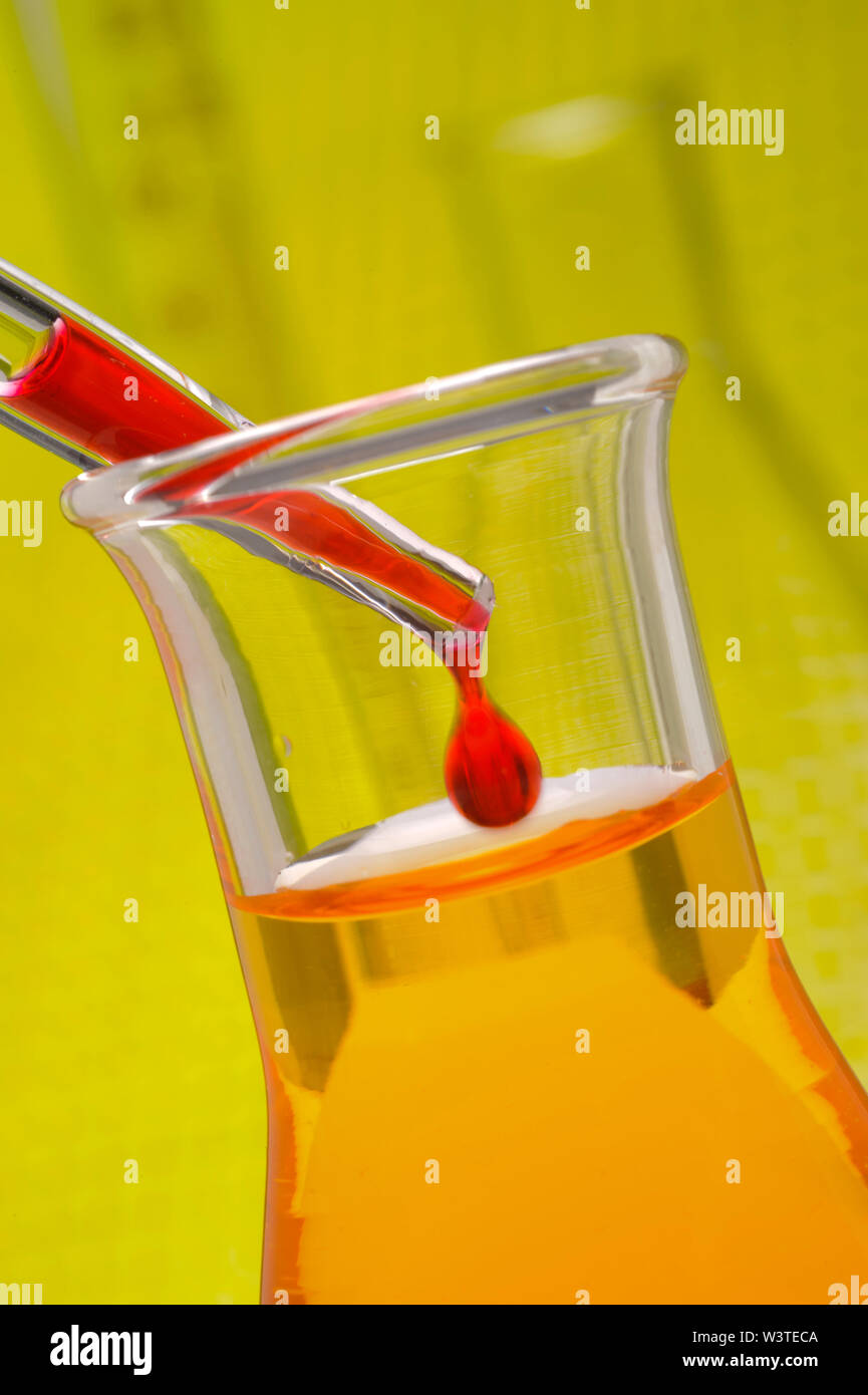 chemical experiment in laboratory with liquid in glassware Stock Photo ...