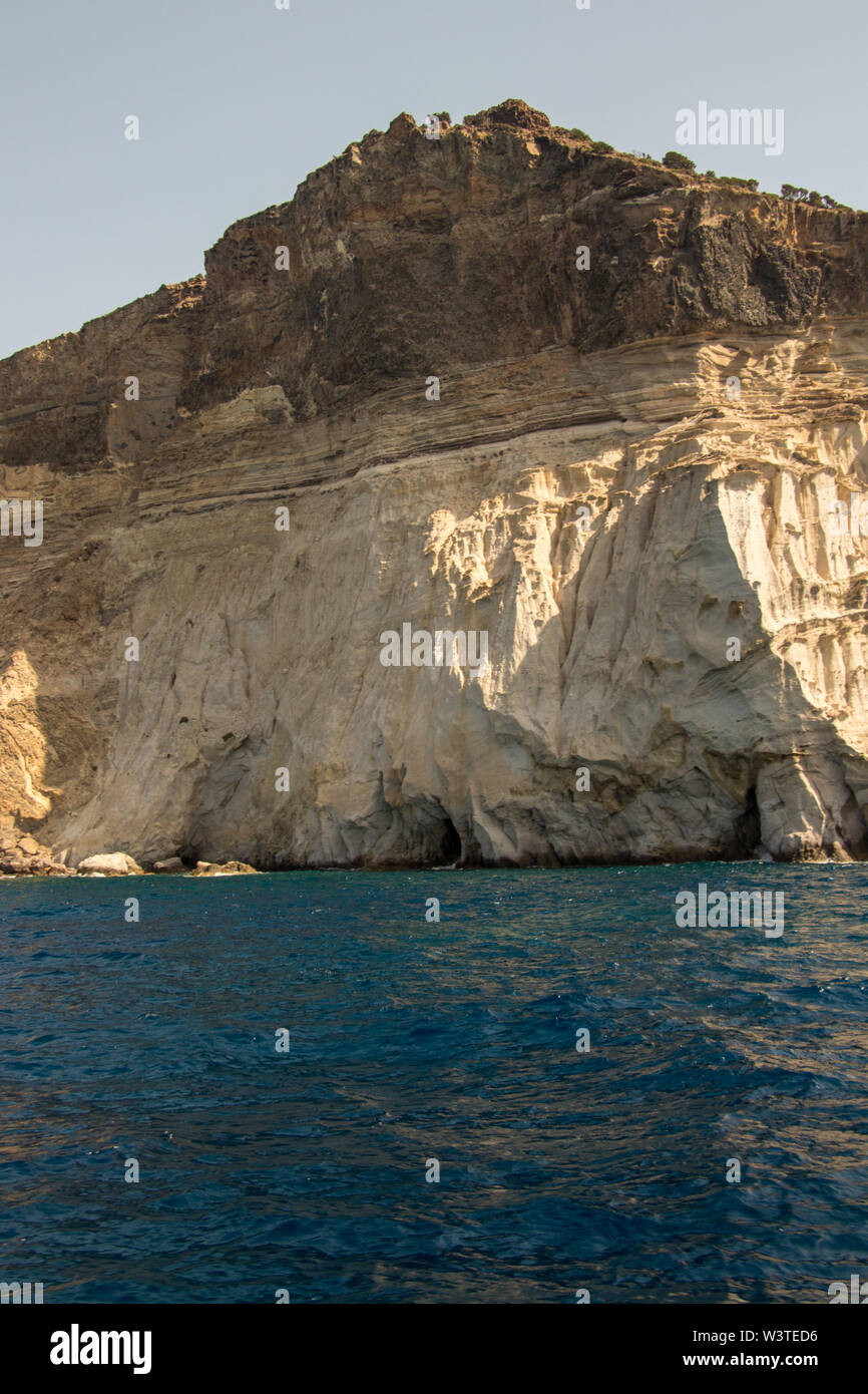 big cliff on Milos island Stock Photo - Alamy