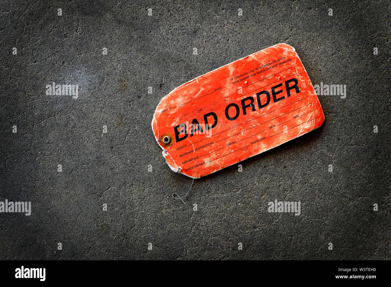 Red tag marker for bad order on ground paper Stock Photo - Alamy