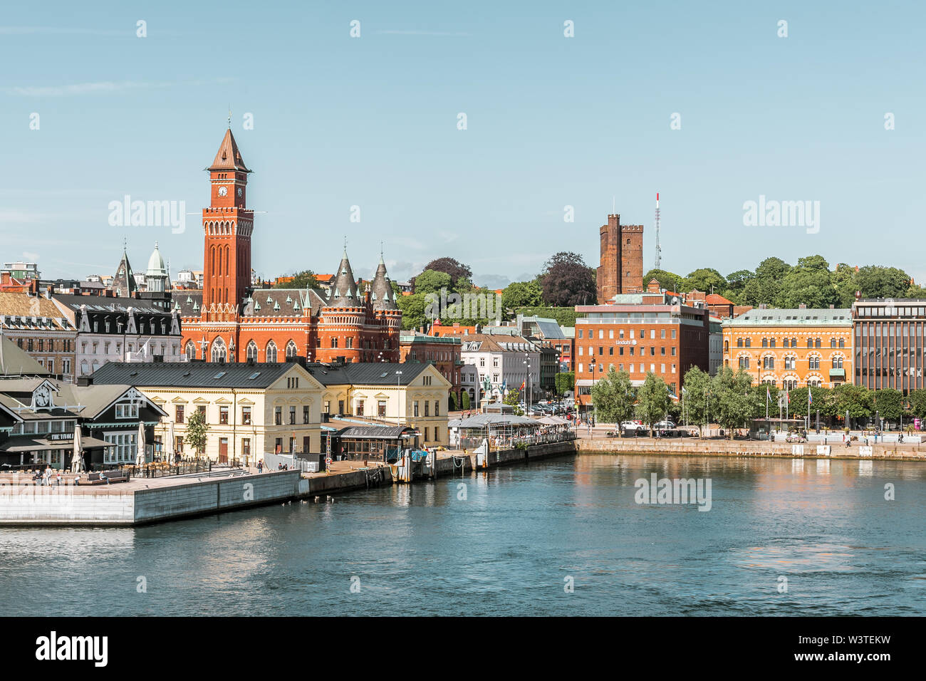 the waterfront harbour in Helsingborg, Sweden with the towers of the ...