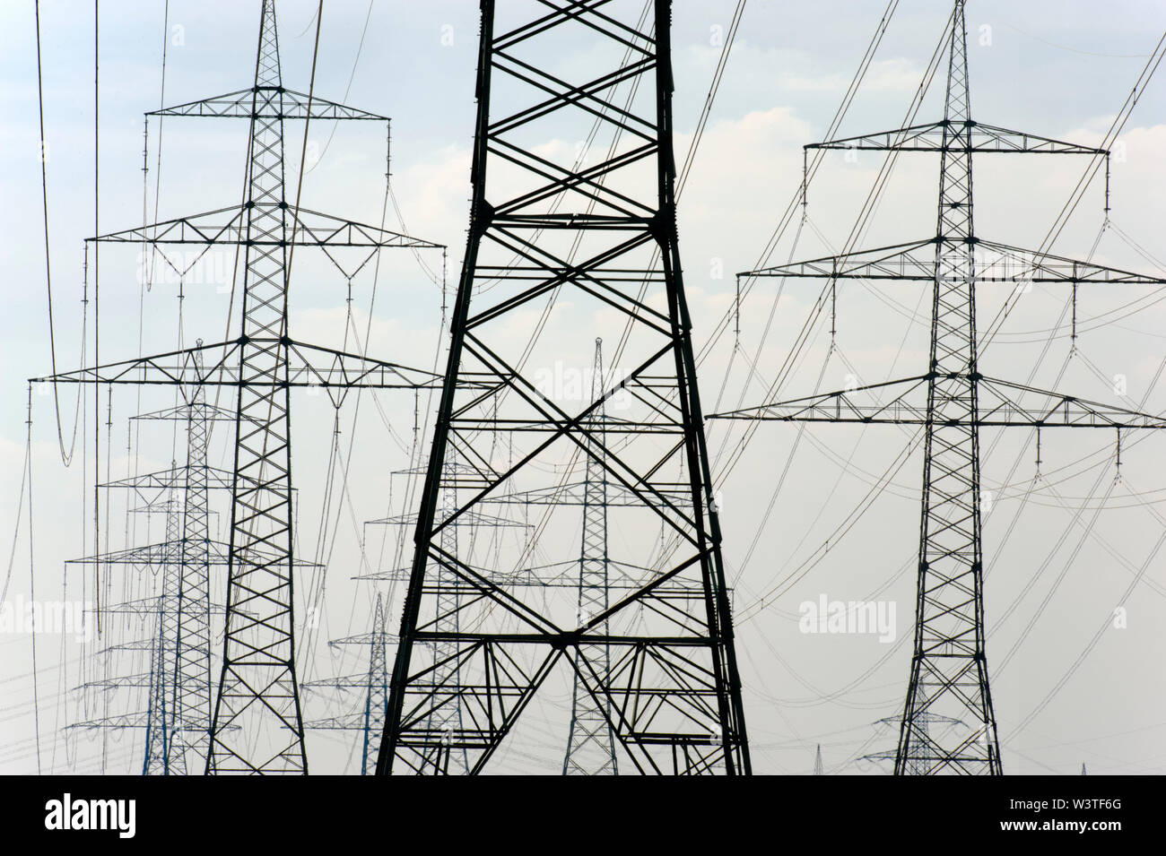 high voltage electric pylons of power station Stock Photo - Alamy
