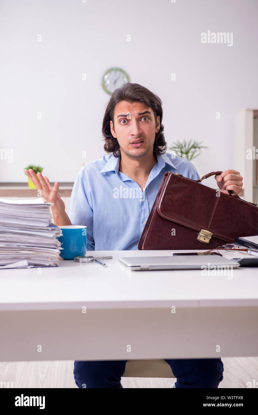 The young male employee working at home Stock Photo - Alamy