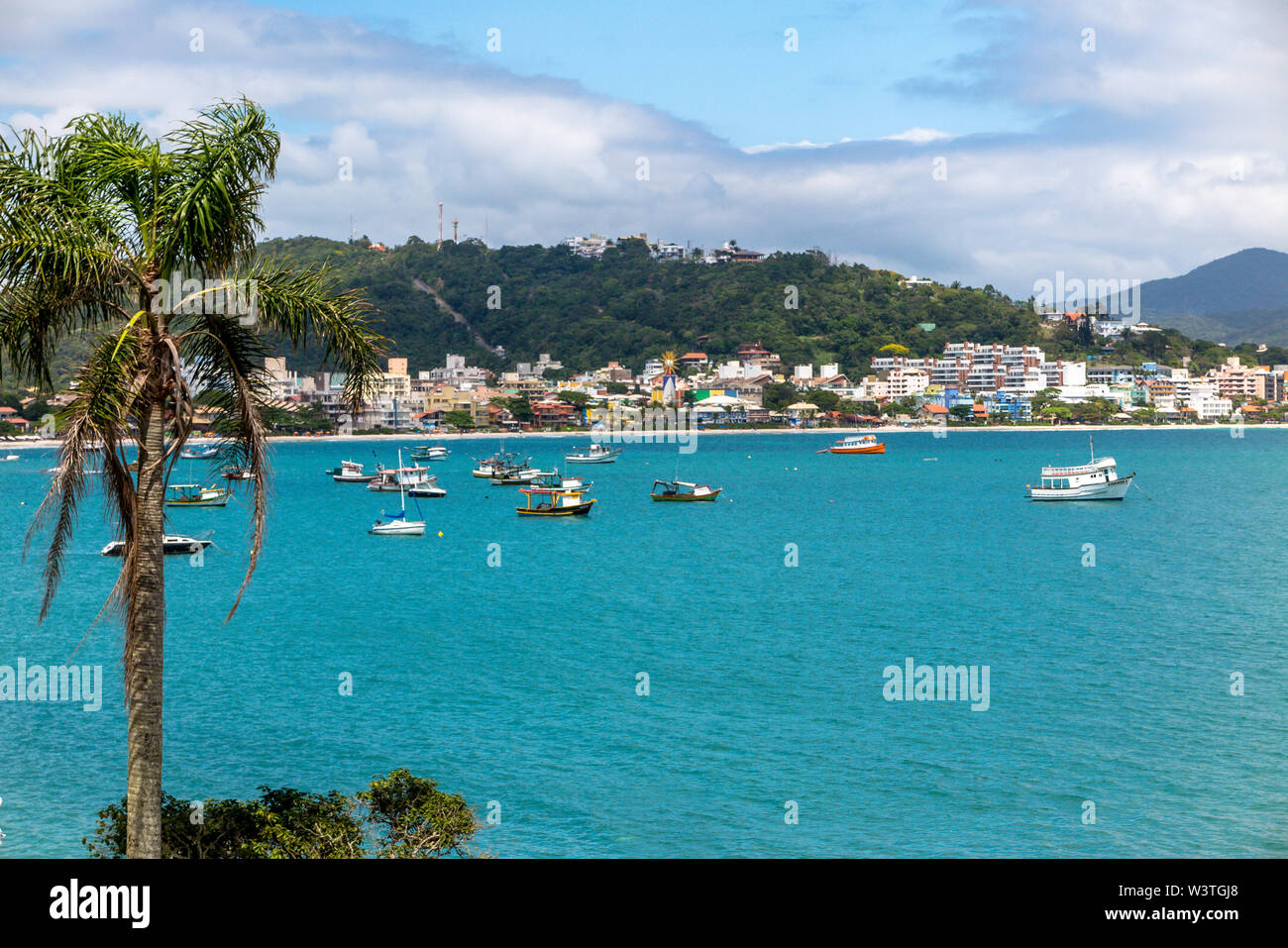 Bombas beach view of Sepultura beach, blue sea with boats and palm tree ...