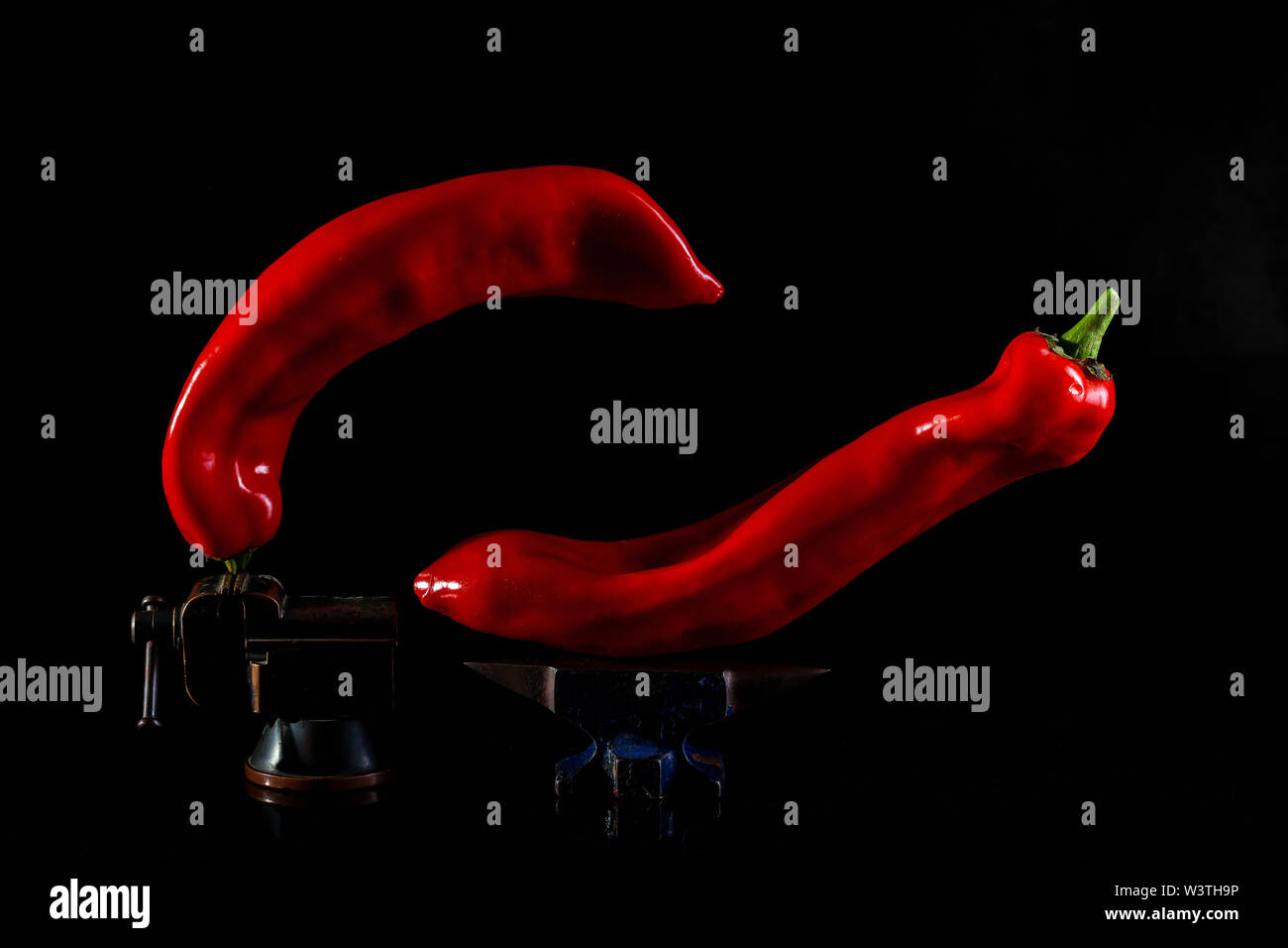 Two red chilli peppers on top of a black analogue camera Stock Photo ...