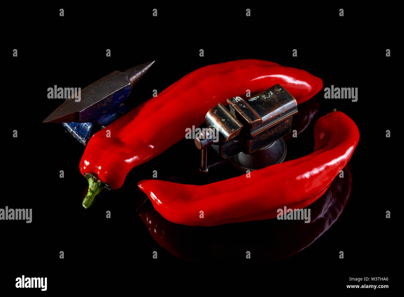 Two red chilli peppers on top of a black analogue camera Stock Photo ...