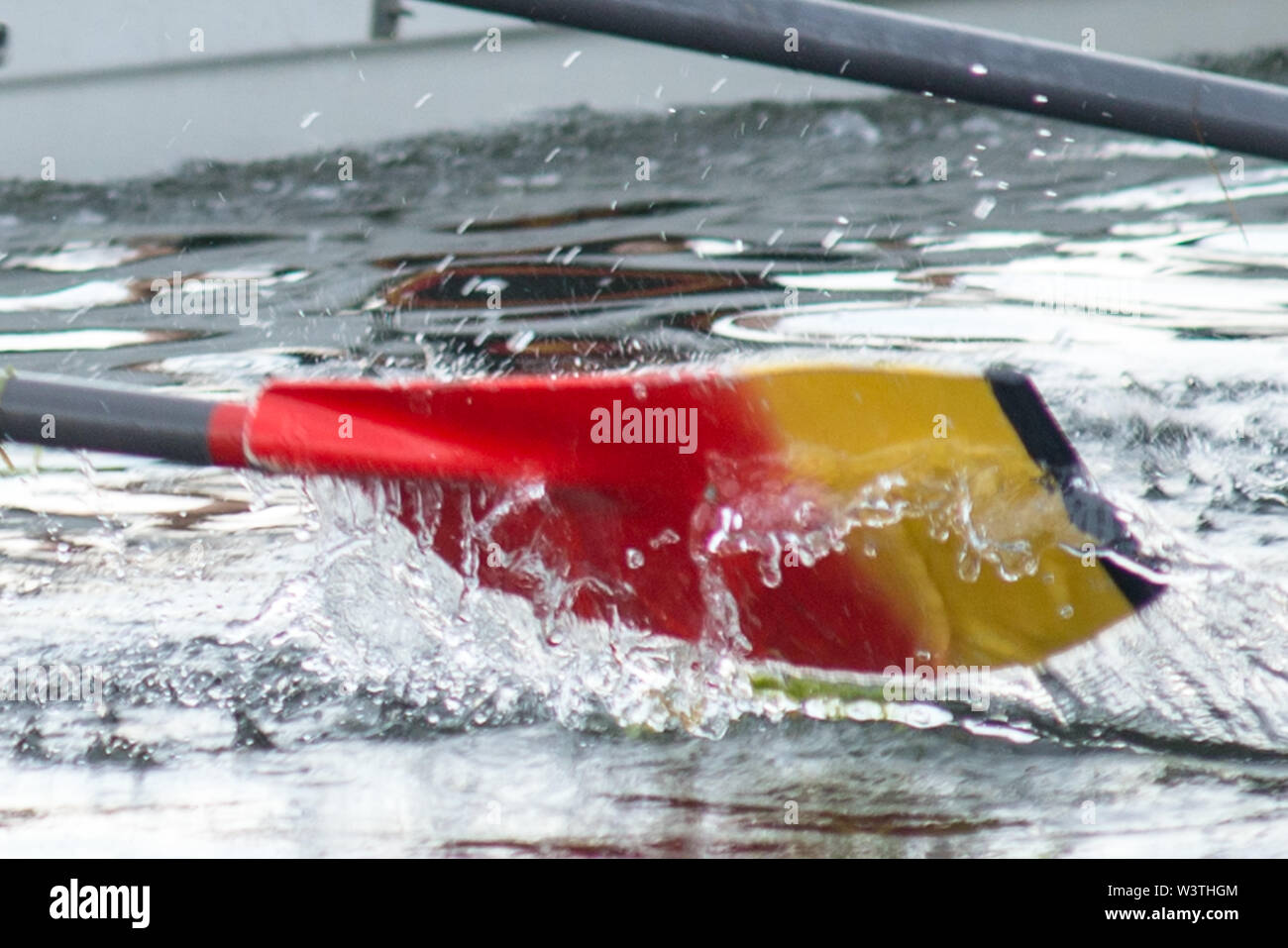 Rowing oar splashing in river Stock Photo - Alamy