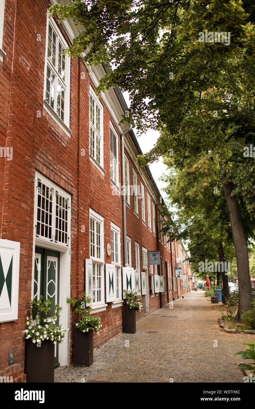 Brick buildings line a street in the historic Dutch Quarter in Potsdam ...