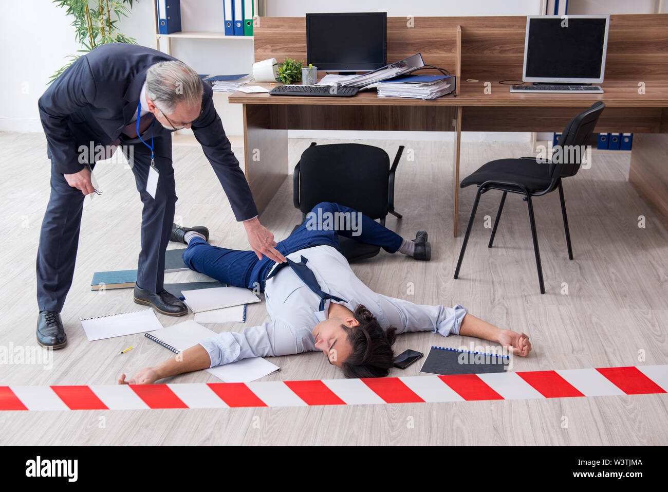 The forensic investigator and dead employee in the office Stock Photo ...