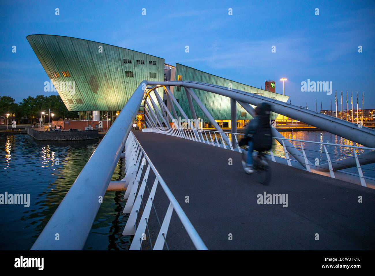 Amsterdam, Netherlands, bridge to the Nemo Science Museum, district on ...