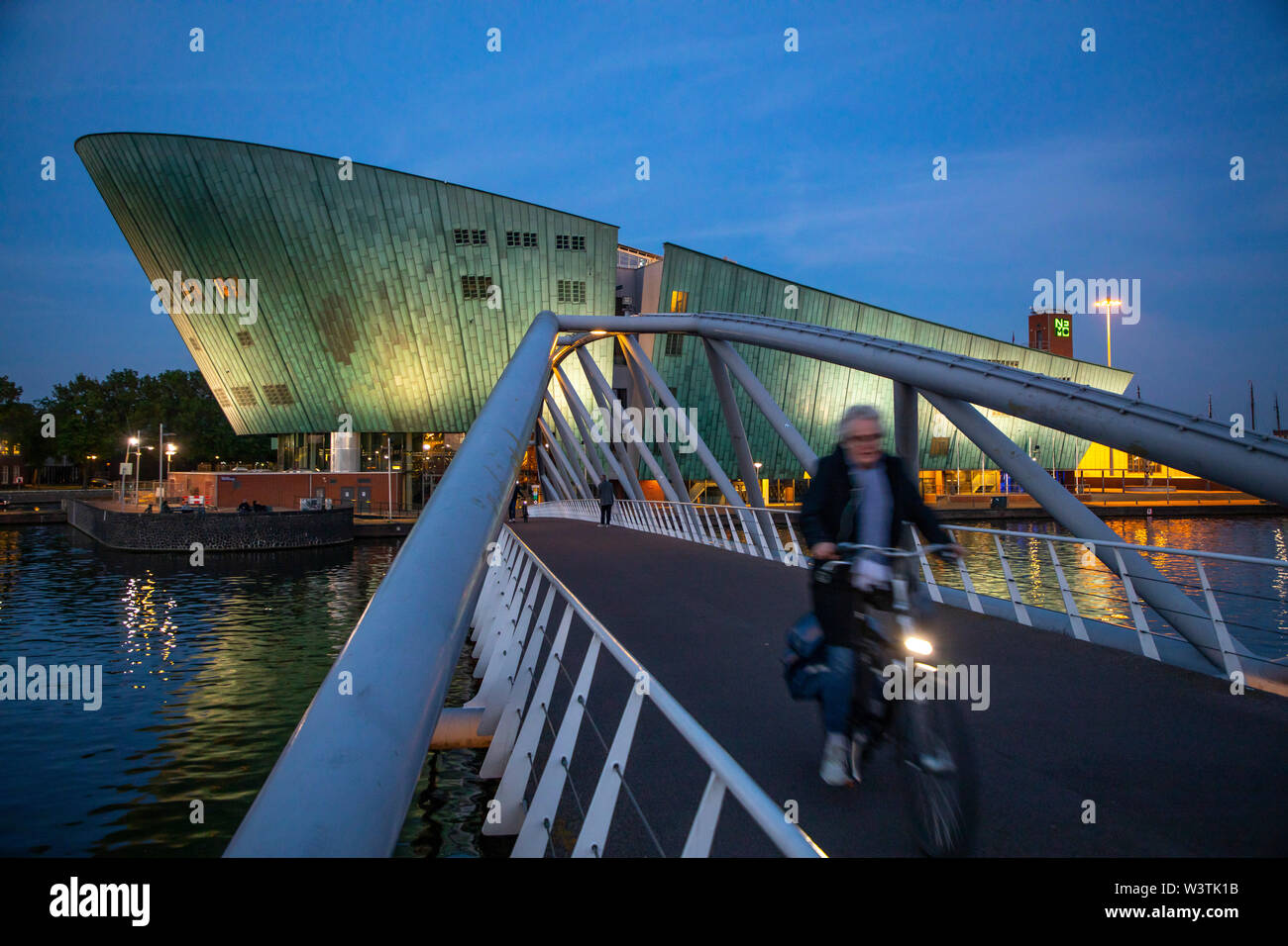 Amsterdam, Netherlands, bridge to the Nemo Science Museum, district on ...