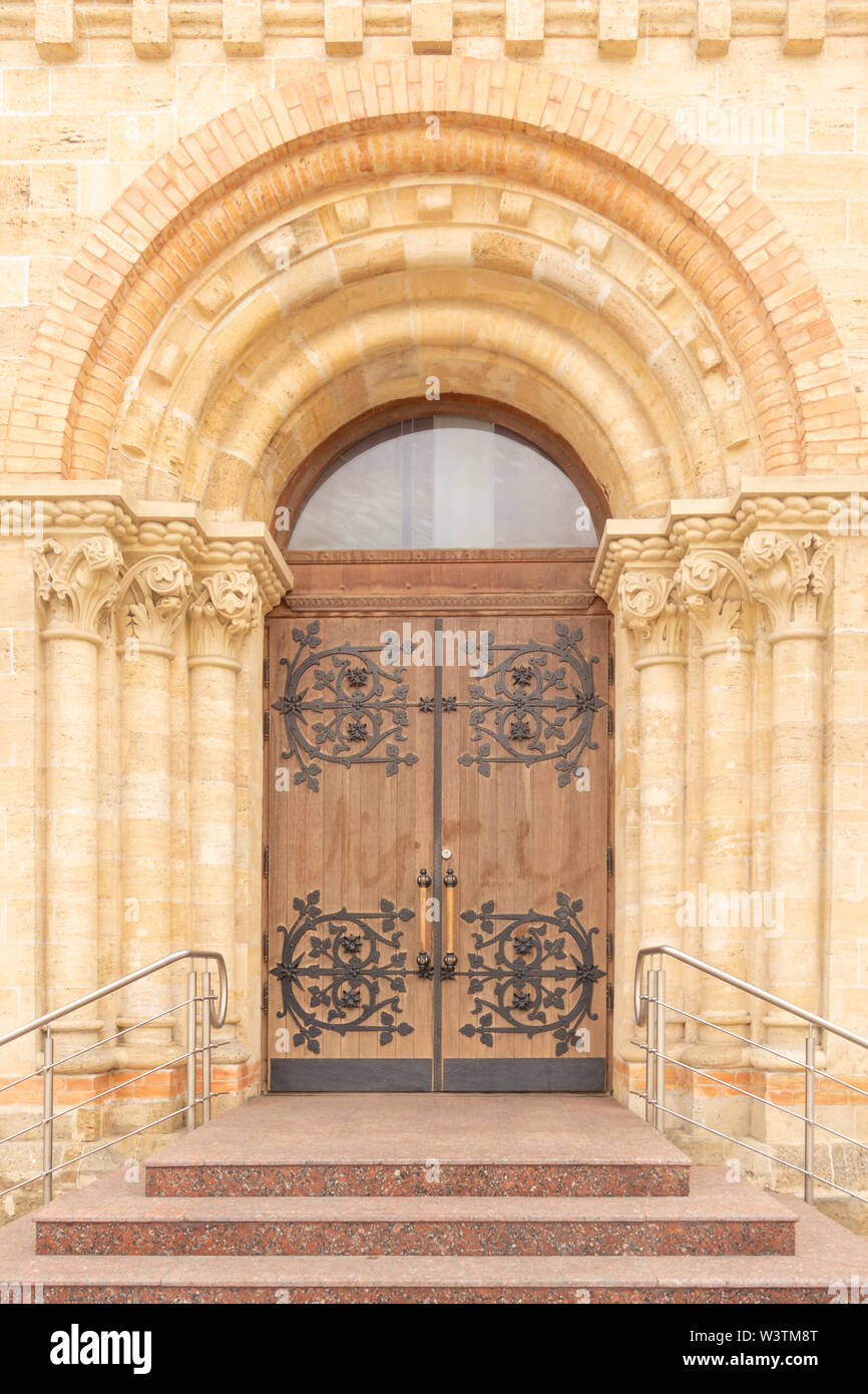 The building is made of natural sandstone. The front door of the temple ...