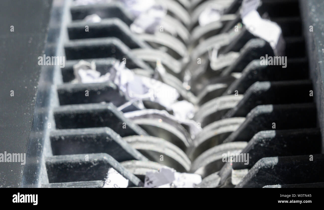 closeup view of office paper shredder teeth Stock Photo - Alamy