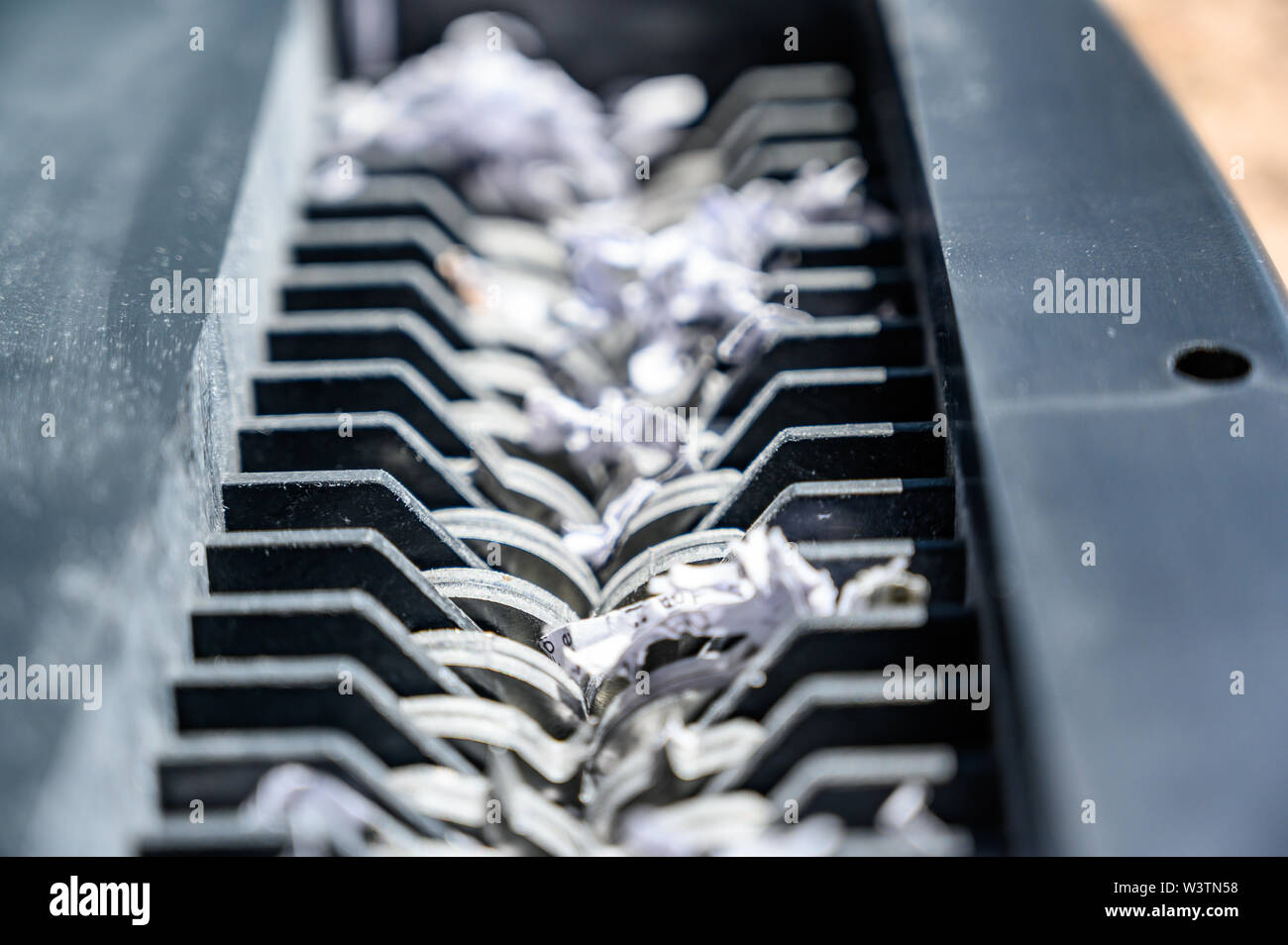 closeup view of office paper shredder teeth Stock Photo - Alamy