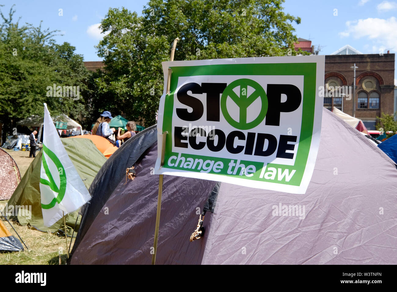 Activist's tent displays sign 'Stop Ecocide' at Extinction Rebellion's ...