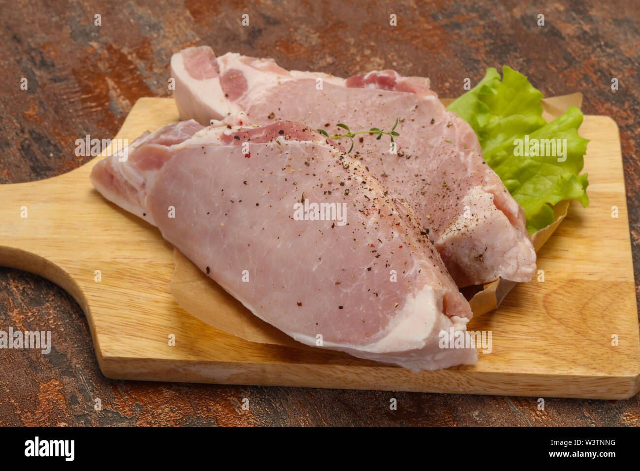 Raw pork meat steak ready for grill Stock Photo - Alamy