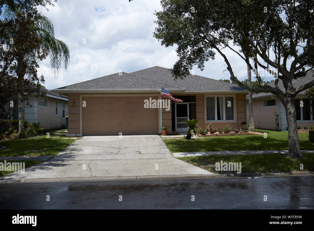 large american house with american flag flying outside in kissimmee ...
