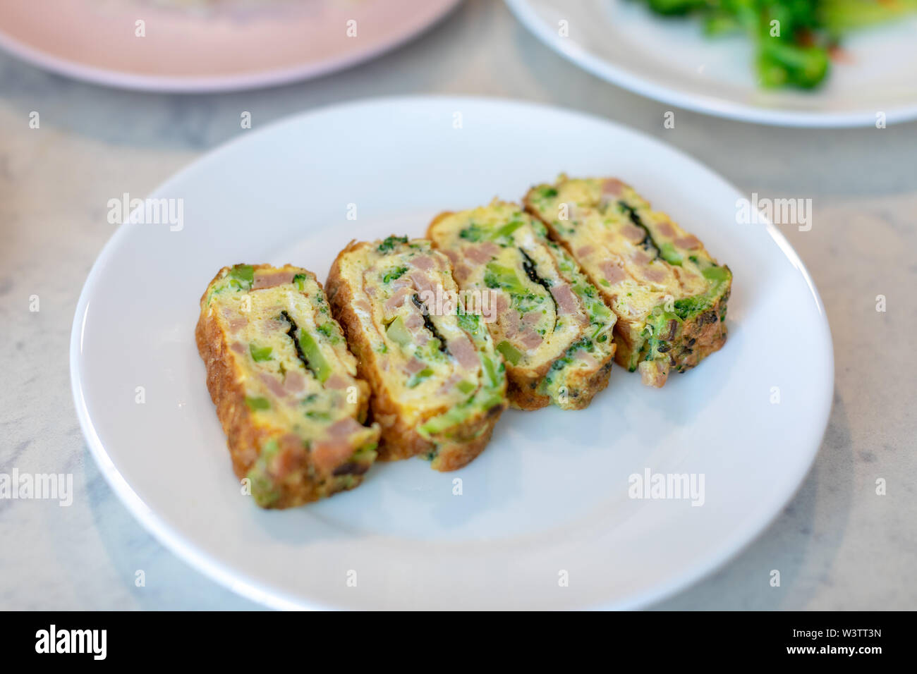 Korean egg rolls mixed ham and broccoli, Tamagoyaki Stock Photo - Alamy
